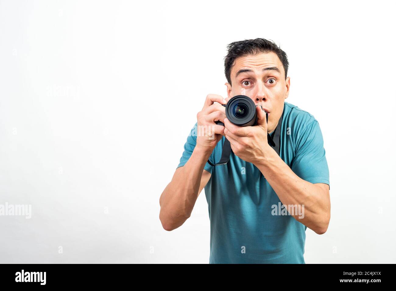 Man with photo camera photographing something very concentrated ...