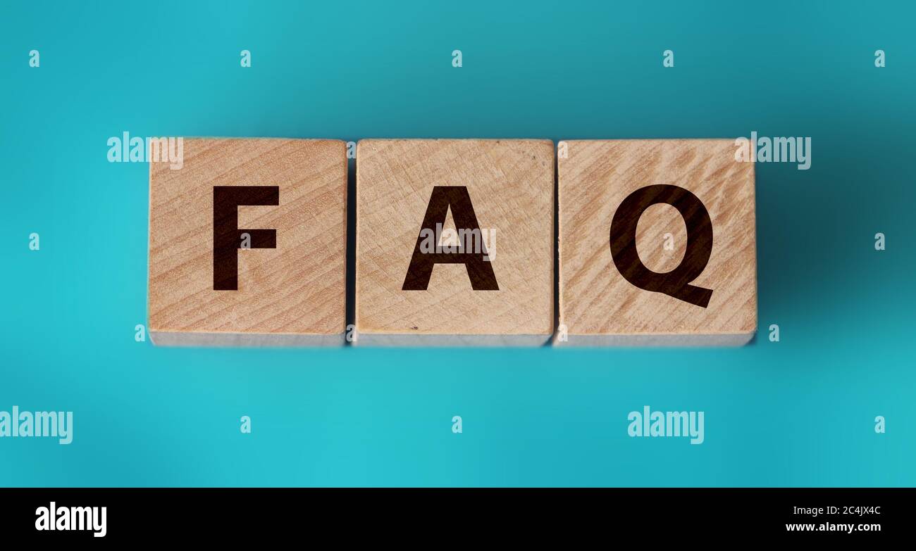 FAQ sign made of wood on an ocean blue table Stock Photo - Alamy
