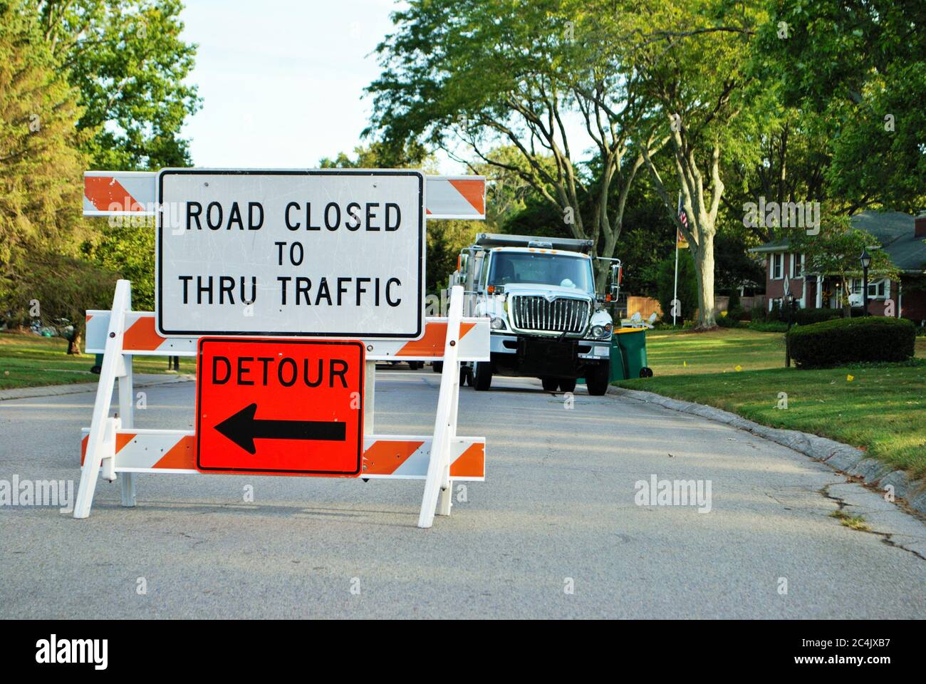 road closed to thru traffic detour construction sign in a residential ...