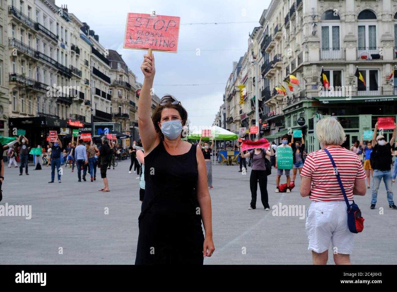Brussels, Belgium. 27th June, 2020. Activists hold up letters that form ...
