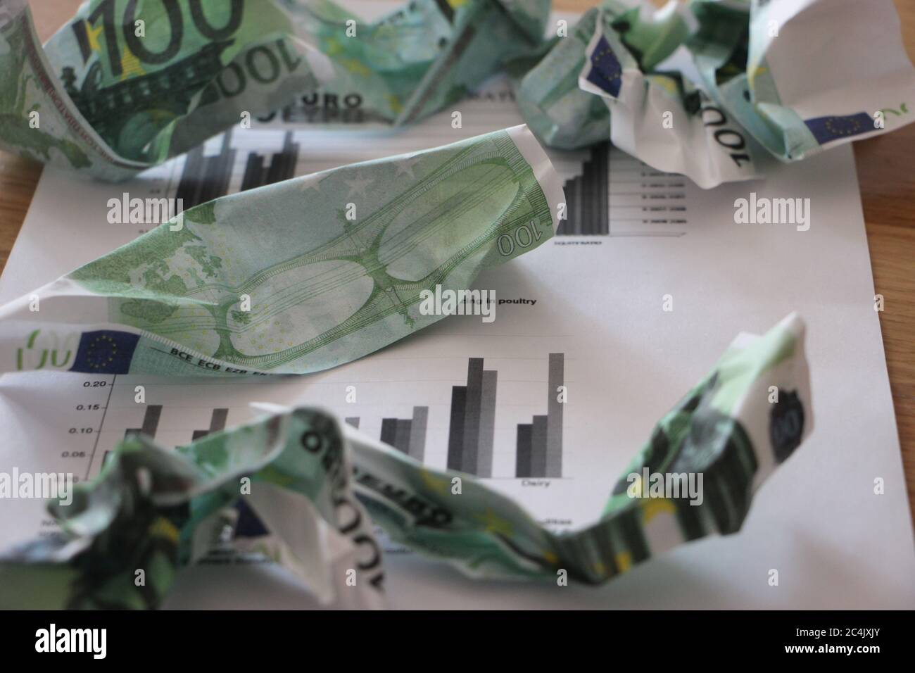 Crumpled 100 euro banknotes on golden background. Selective focus ...