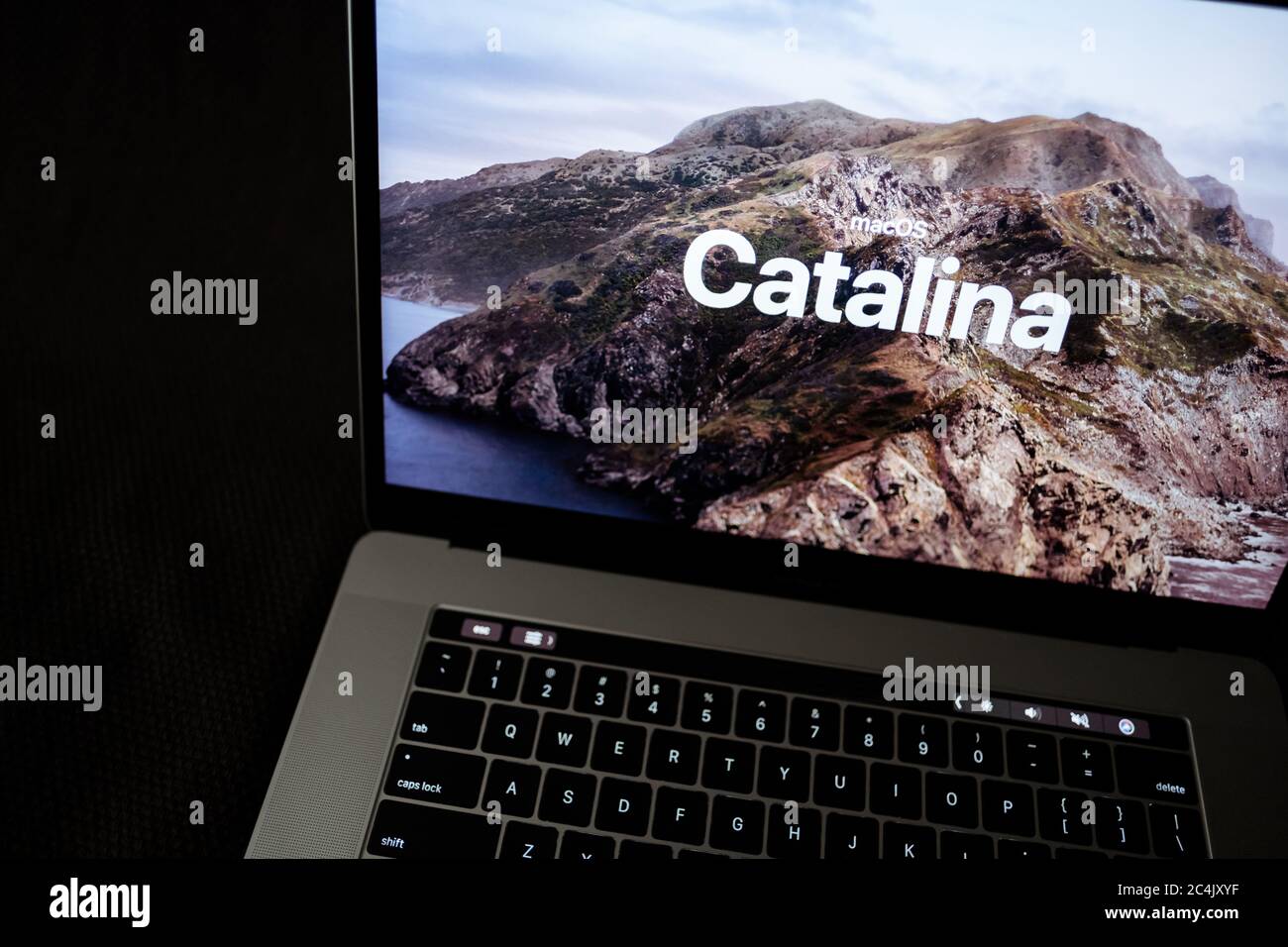 MacBook with Mac OS Catalina background logo on the screen Stock Photo ...