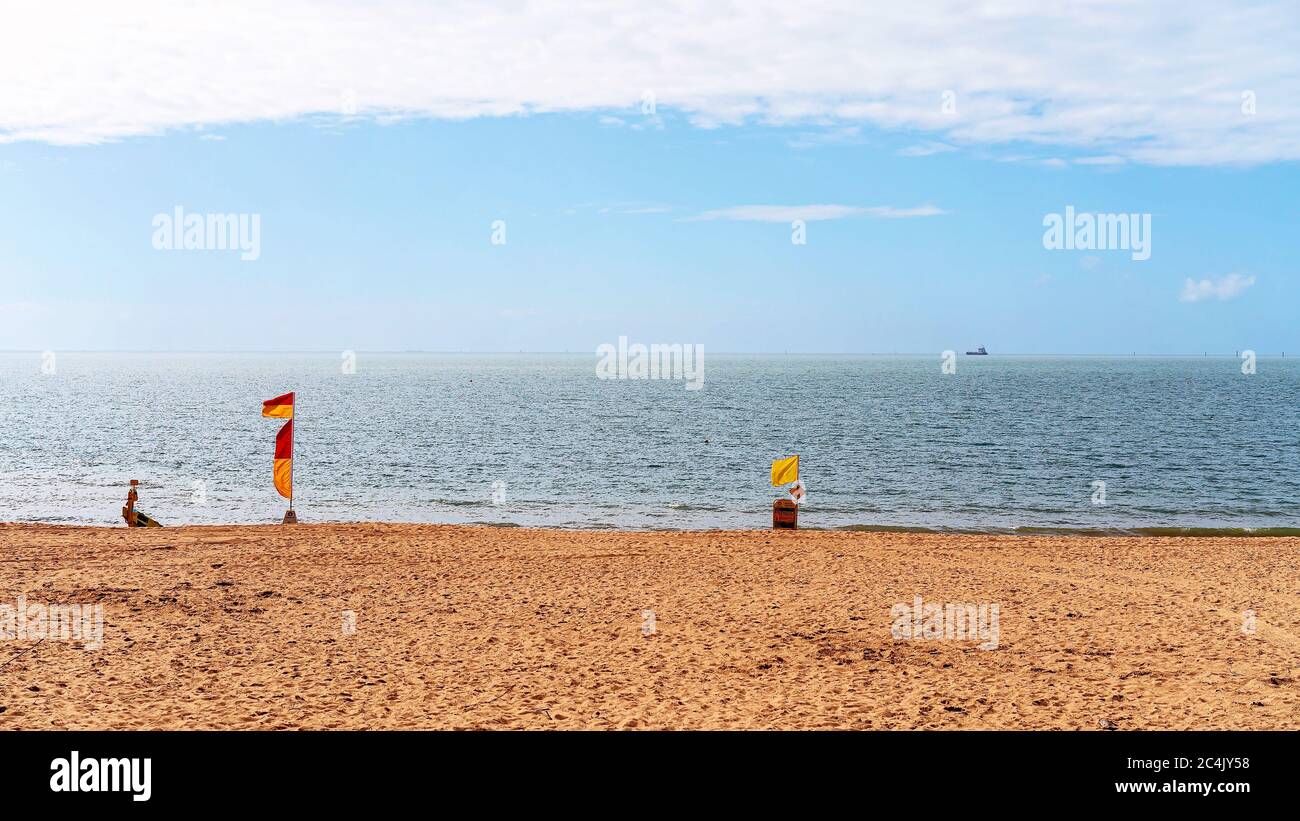 Surf lifesaving flags at the beach indicating where to swim Stock Photo ...