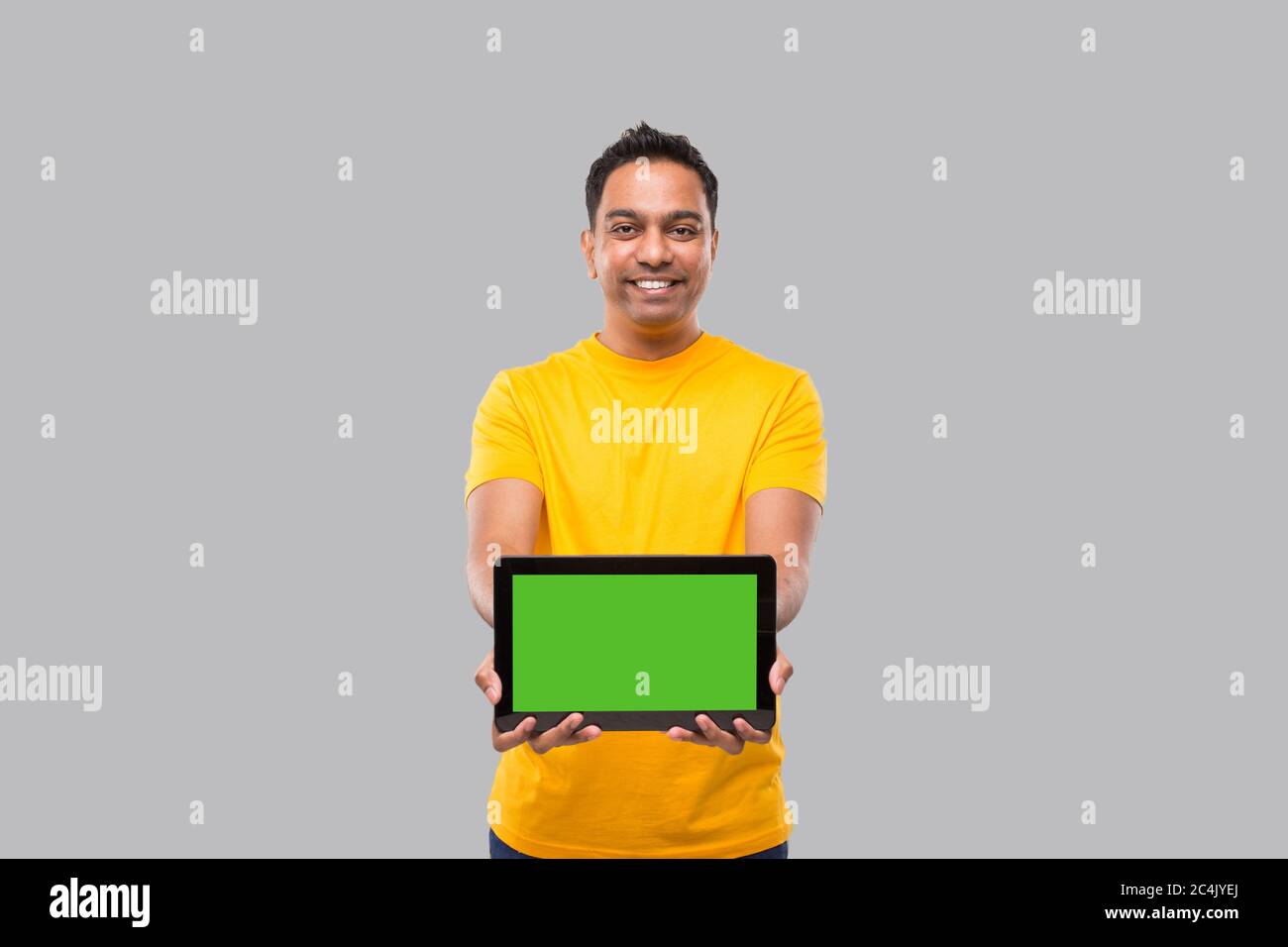 Indian Man Showing Tablet. Indian Boy with tablet in Hands. Home ...