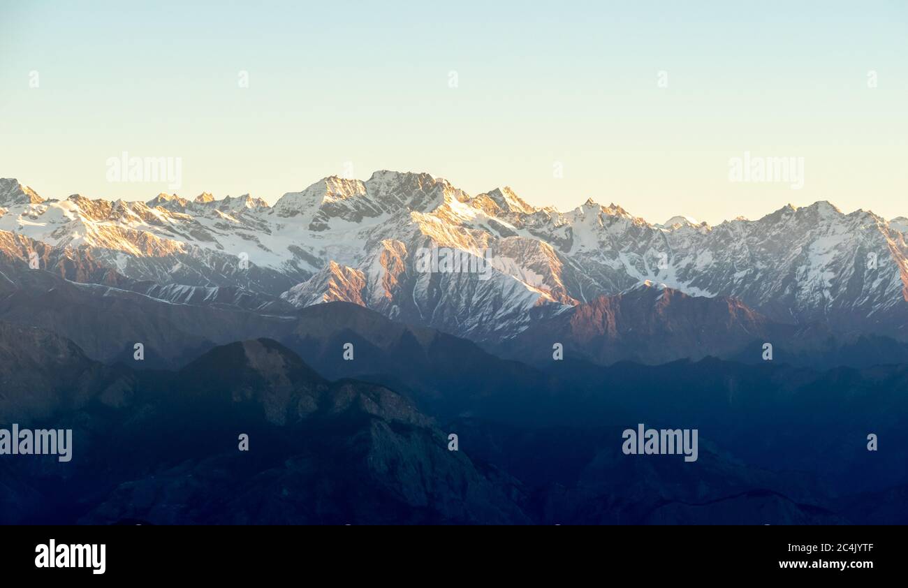 Golden hues of the morning sun over the mountain tops, Shivalik ...