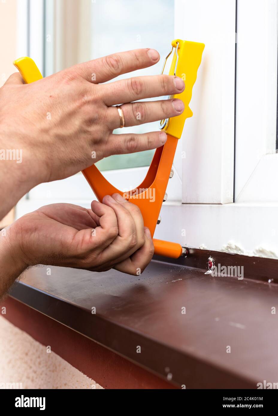 Construction work - installation of rivets. Window tint repair. Plastic ...