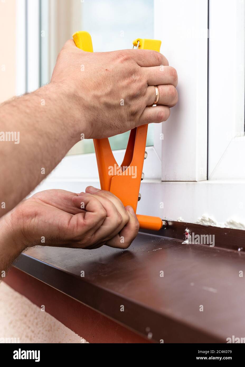 Construction work - installation of rivets. Window tint repair. Plastic ...