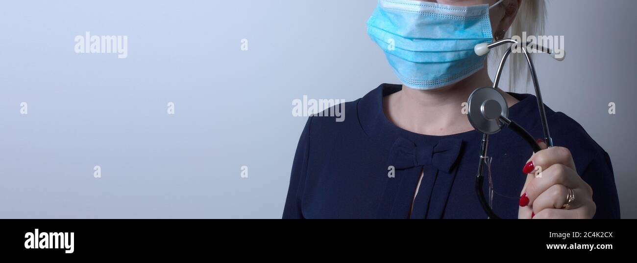 Closeup of a female healthcare professional nurse wearing a protection ...