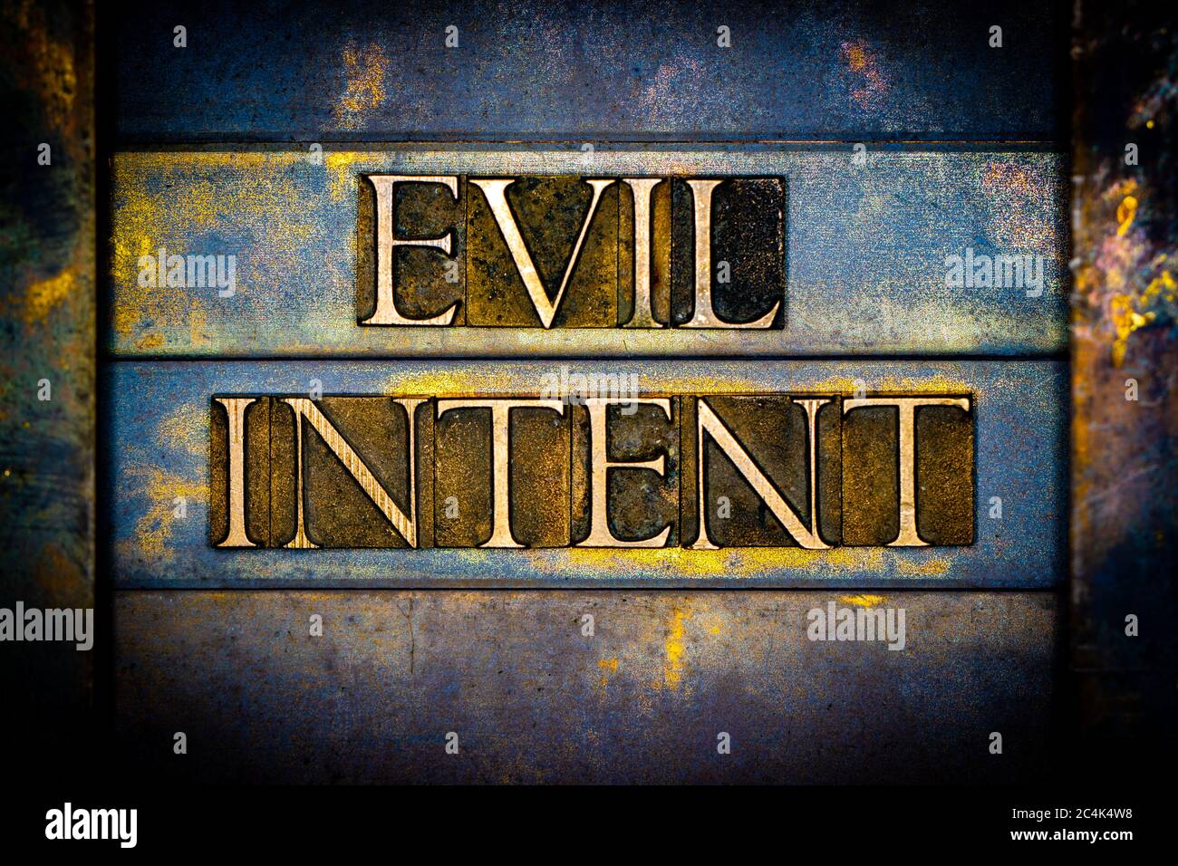 Evil Intent text formed with real authentic typeset letters on vintage ...