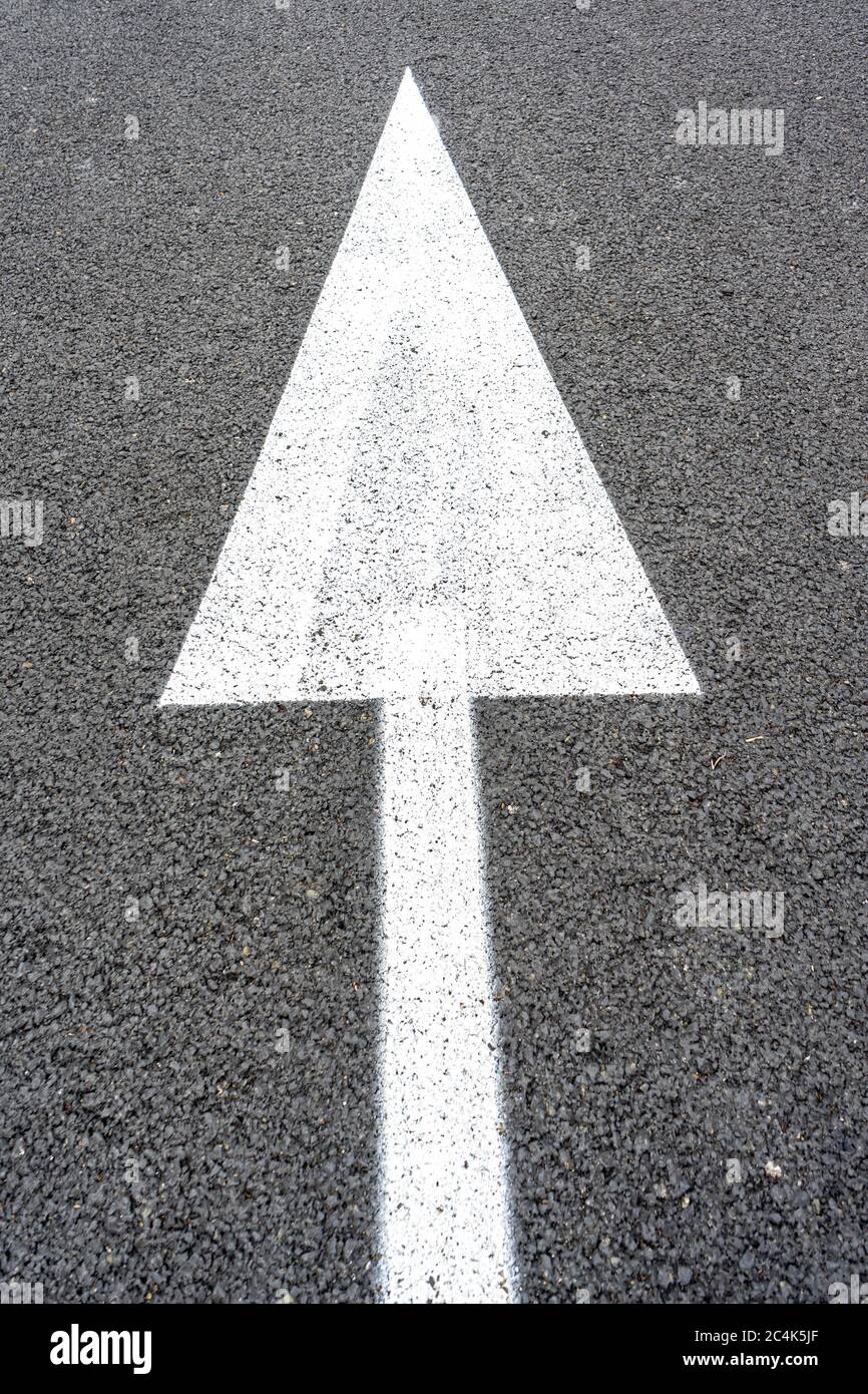 Street signs on the road. Arrow pointing forward, direction indicator ...