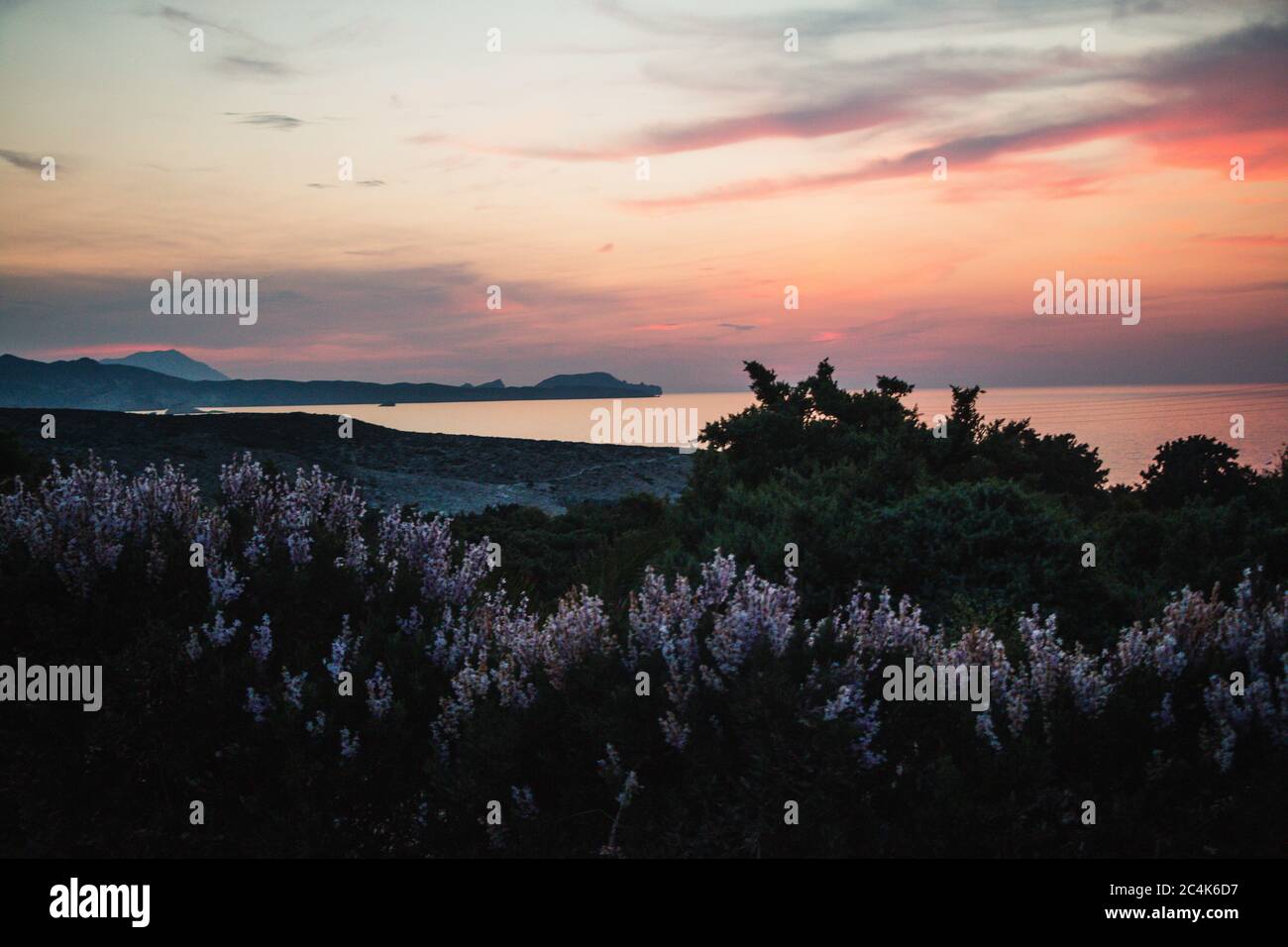 A vibrant sunset overlooking a picturesque, countryside landscape in ...