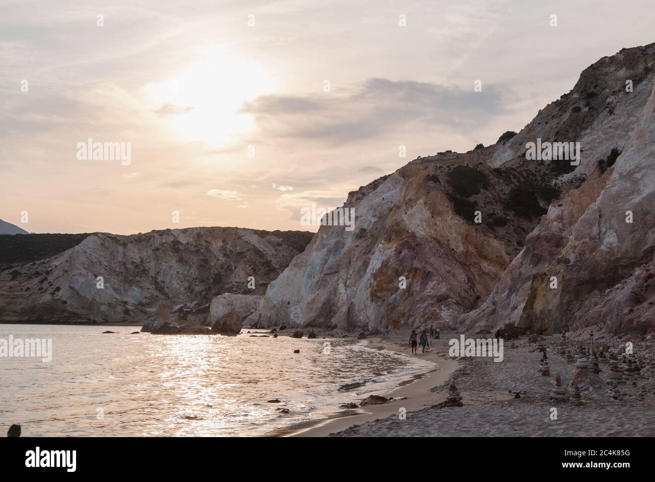 A dramatic sunset over Firiplaka Beach in Milos, Greece Stock Photo - Alamy
