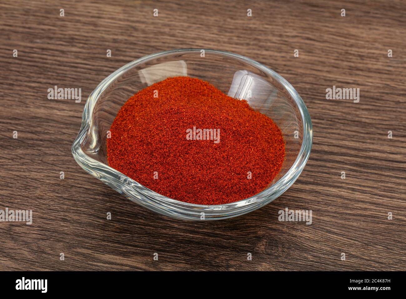 Dry paprika powder in the bowl for cooking Stock Photo - Alamy