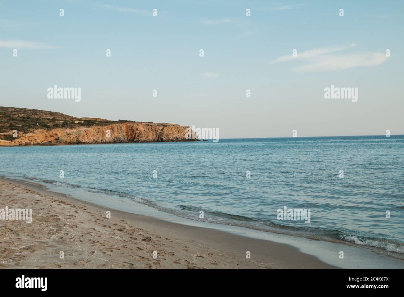 Landscape view of Firiplaka Beach at sunset, Milos, Greece Stock Photo ...