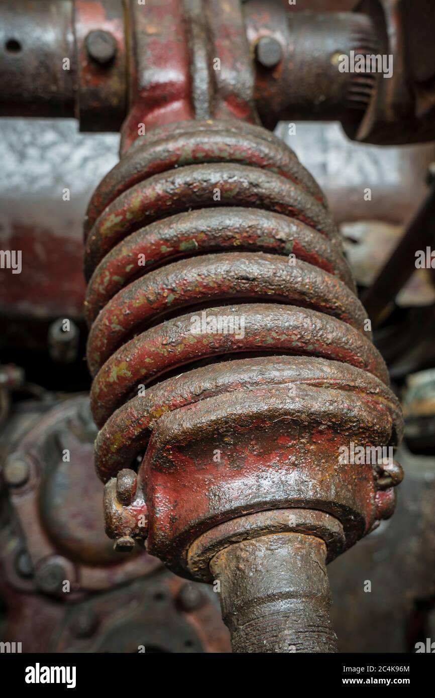 spring mechanism on an old agricultural machine Stock Photo - Alamy
