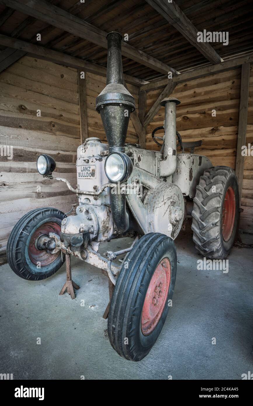 old tractor in a farm barn Stock Photo - Alamy