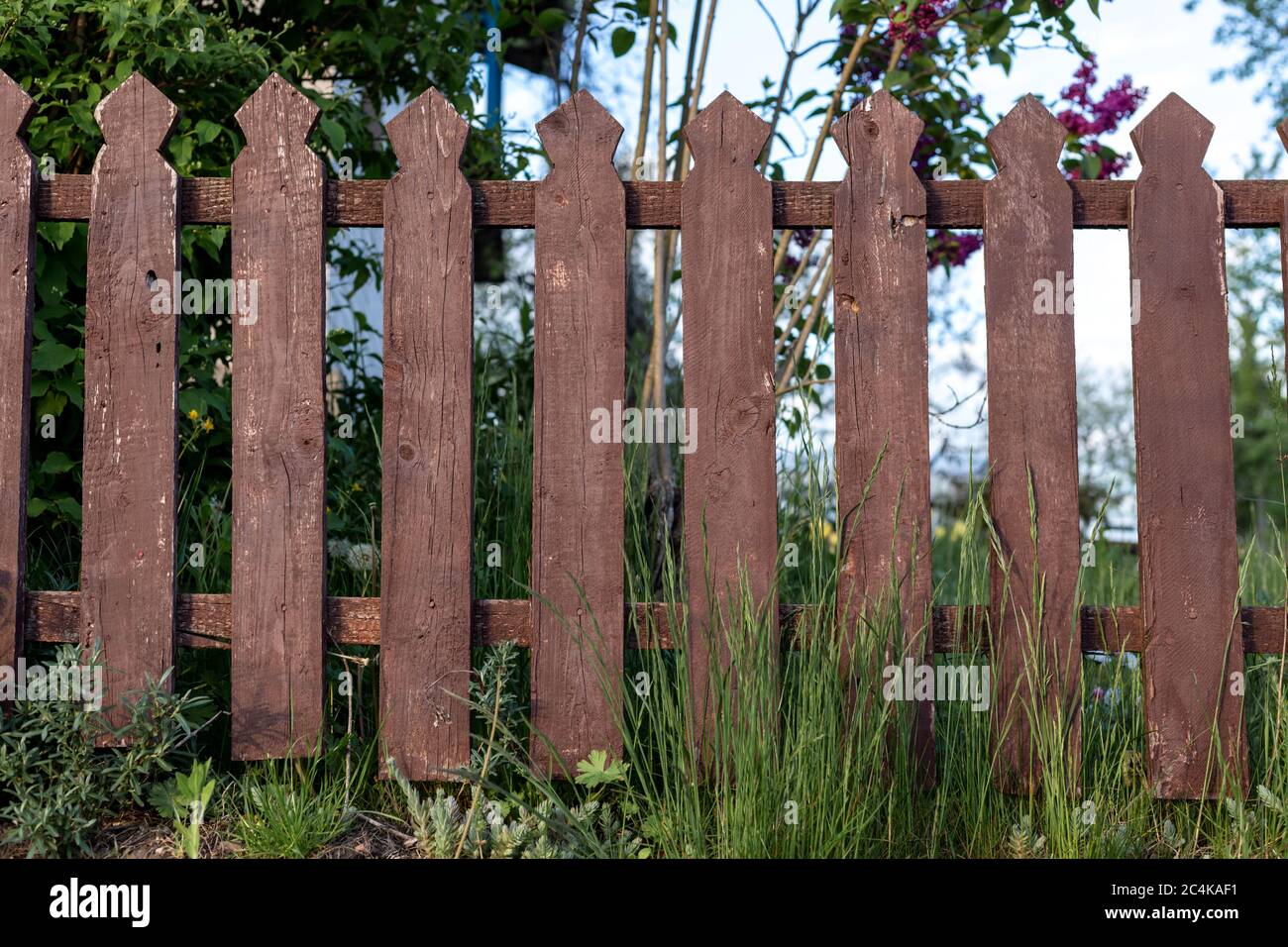 A wooden fence in the village Stock Photo - Alamy