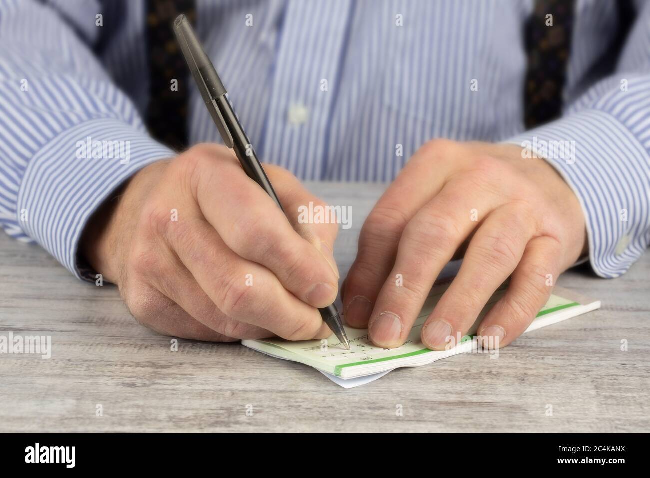 Hand writing cheque hi-res stock photography and images - Alamy