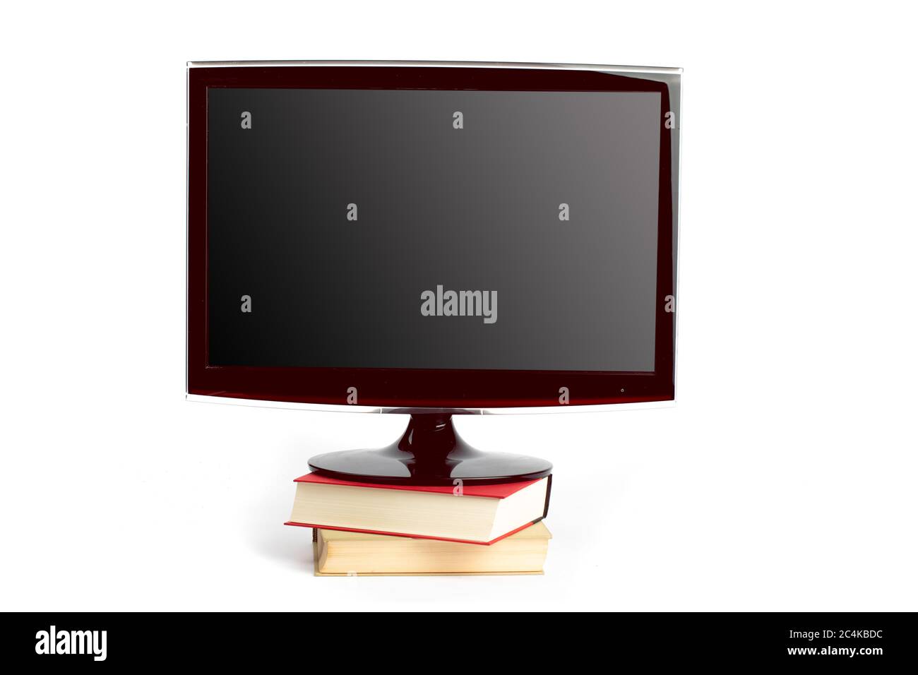 old books holding up a computer monitor demonstrating the concept of ...