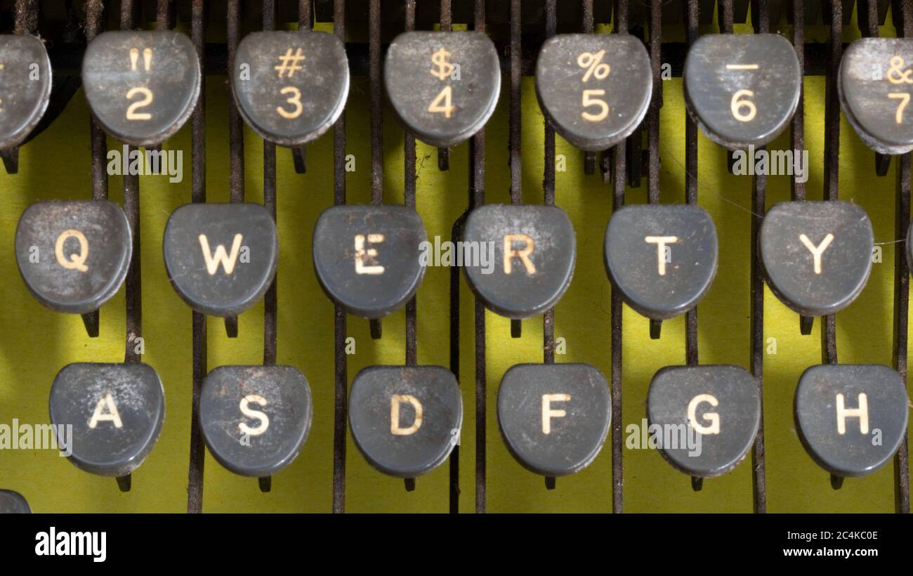 the QWERTY keys on an old grungy manual typewriter Stock Photo - Alamy
