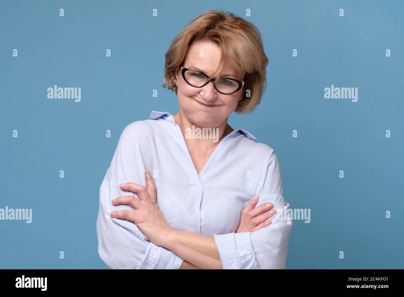 Senior caucasian woman with puffing out cheeks holding breathe Stock ...