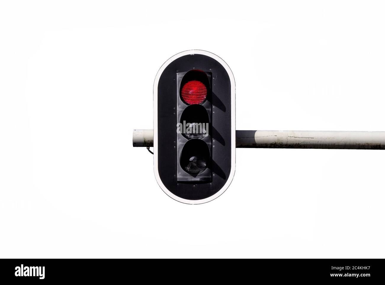 Closeup shot of a traffic light with the red signal light on in front ...