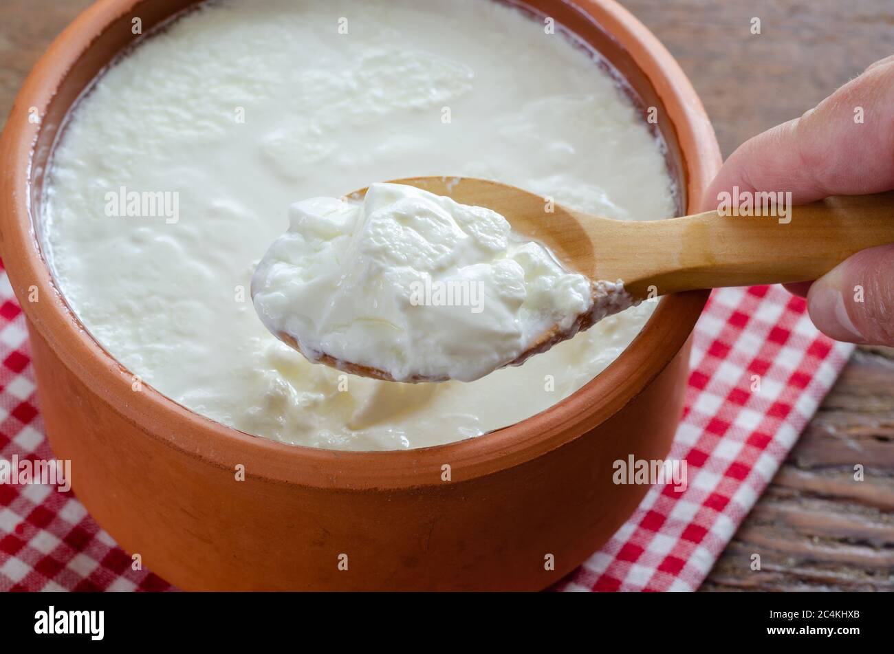 Traditional Turkish Yogurt in earthen pot on the wooden table Stock ...