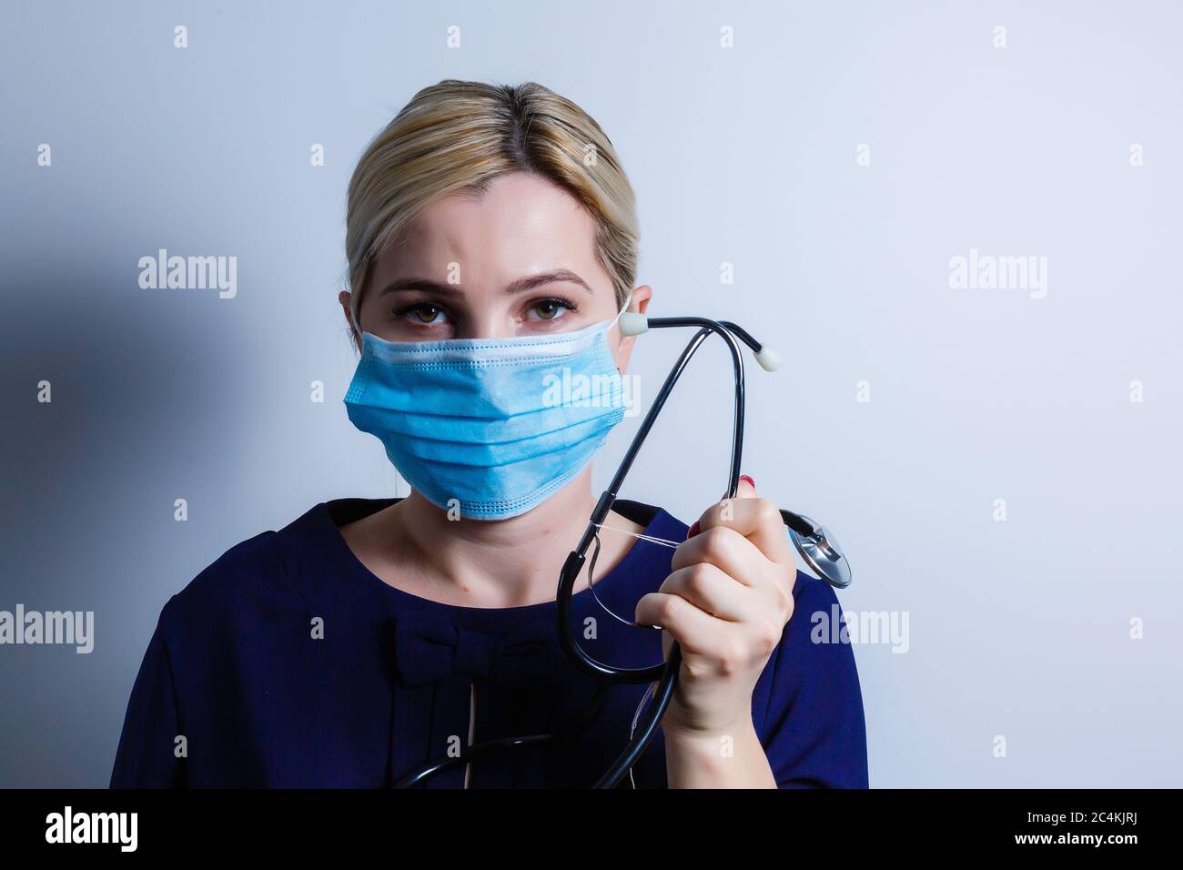 Closeup of a female healthcare professional nurse wearing a protection ...
