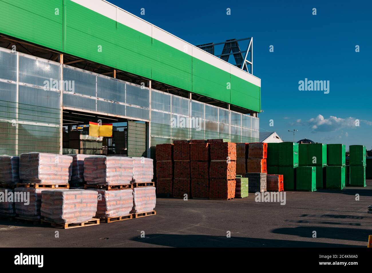 Stack of construction materials in the warehouse Stock Photo - Alamy