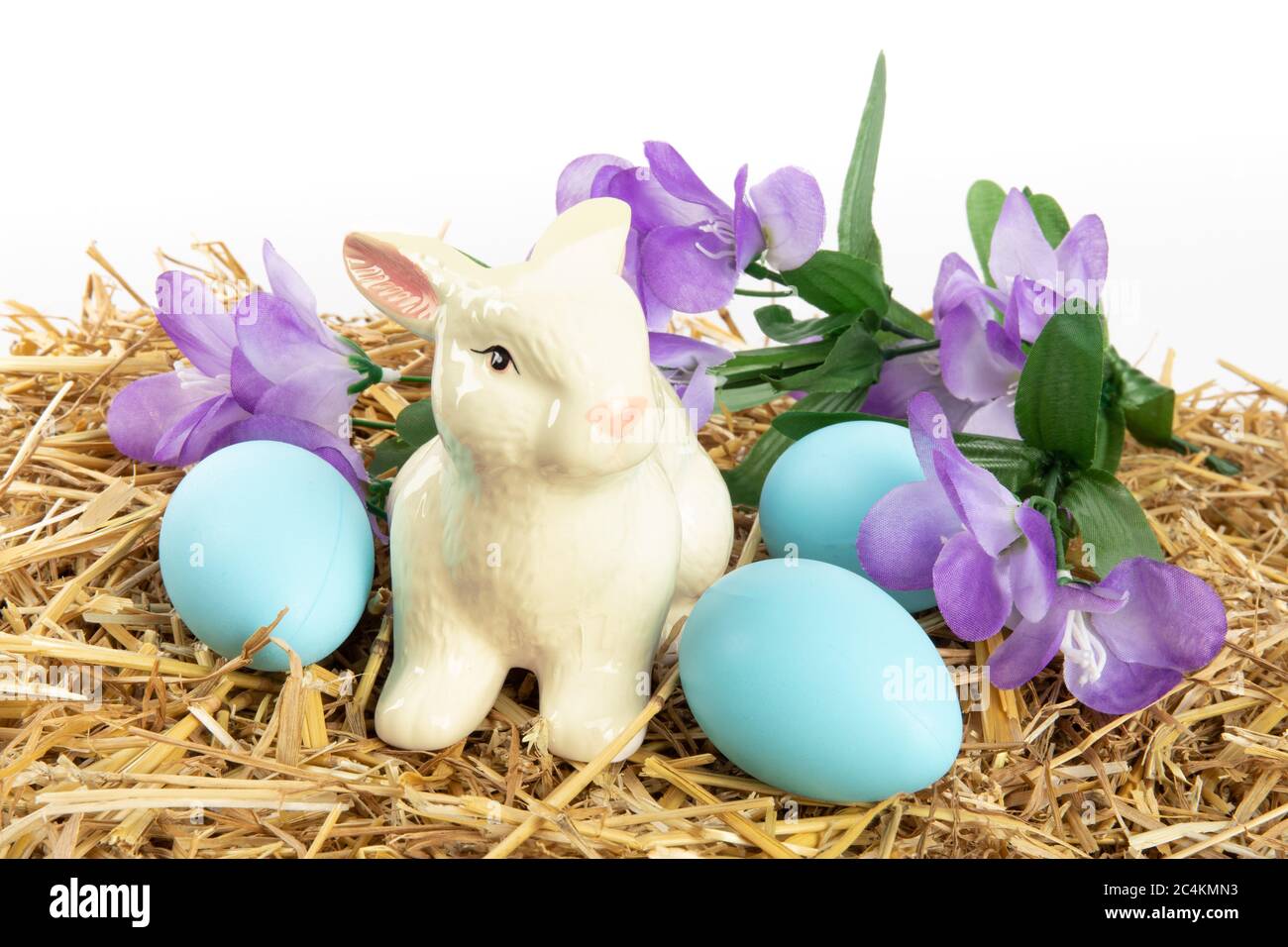 farm Easter, an Easter bunny, colorful Easter eggs and flowers on a hay ...