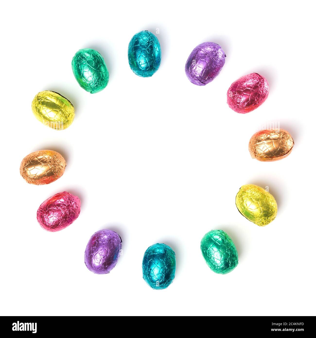 Circle made of chocolate easter eggs wrapped in multi colored foil ...