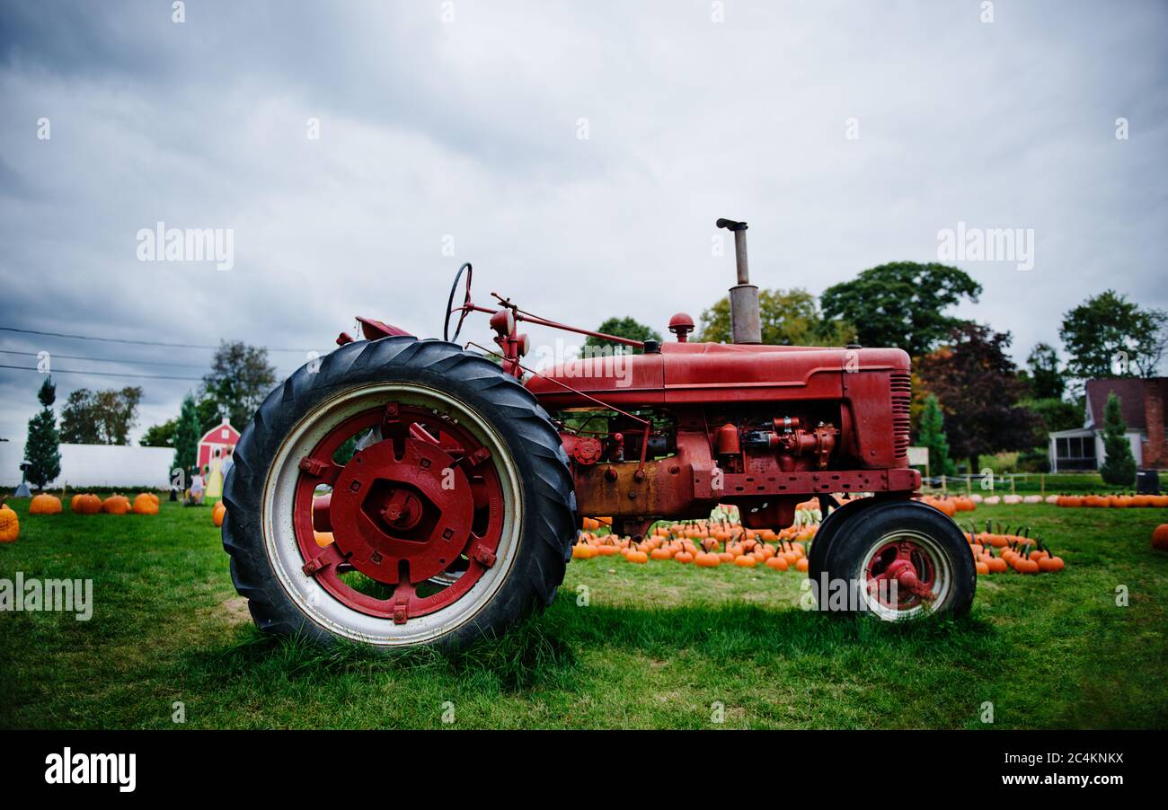 old red tractor on a farm Stock Photo - Alamy