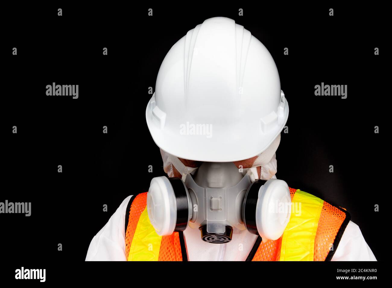 a person in a haz mat suit wearing an industrial dust and chemical mask ...