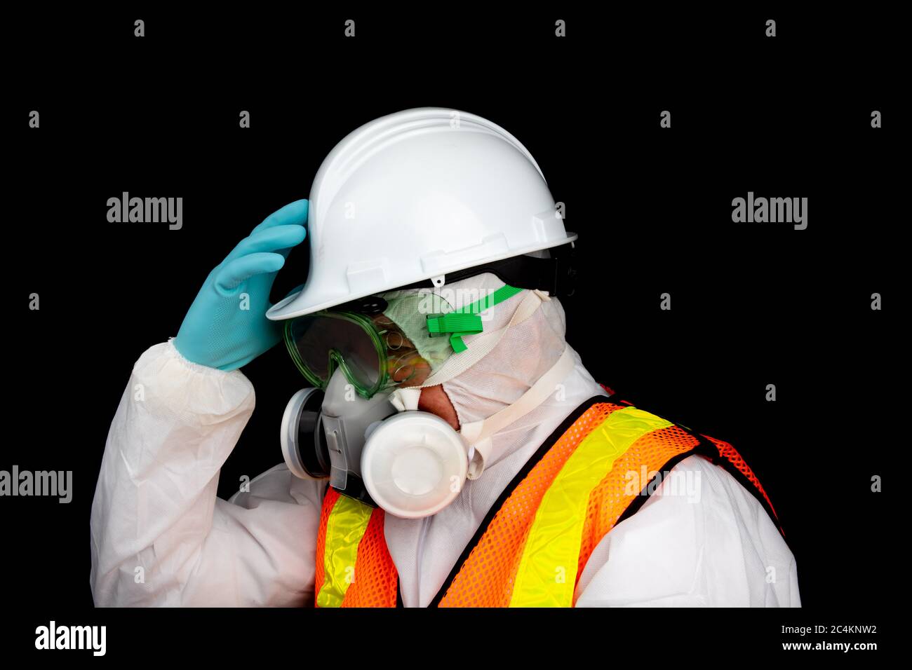 a person in a haz mat suit wearing an industrial dust and chemical mask ...