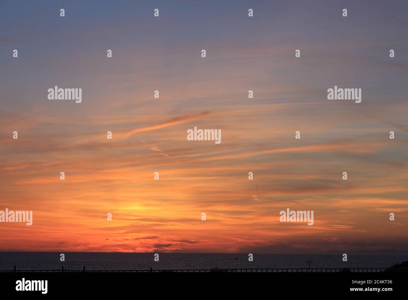 Beautiful scenery of the red horizon and cloudy sky captured during the ...