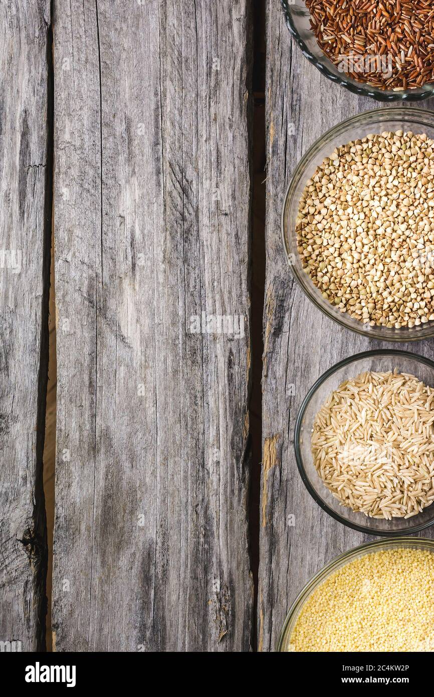 Close up shot of various types of fresh grains in small glass bowls ...