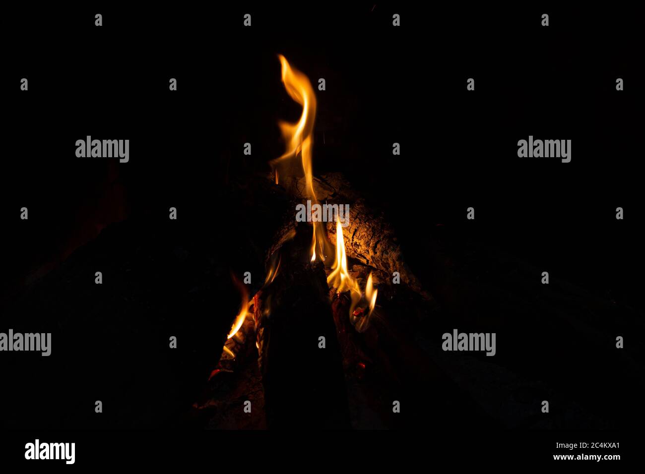 Closeup of a campfire on the ground at night - perfect for wallpapers ...