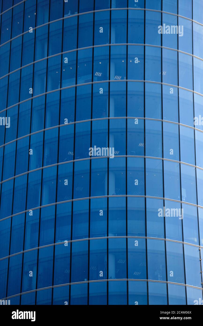 Luxury skyscraper with glass high windows. Blue toned Stock Photo - Alamy