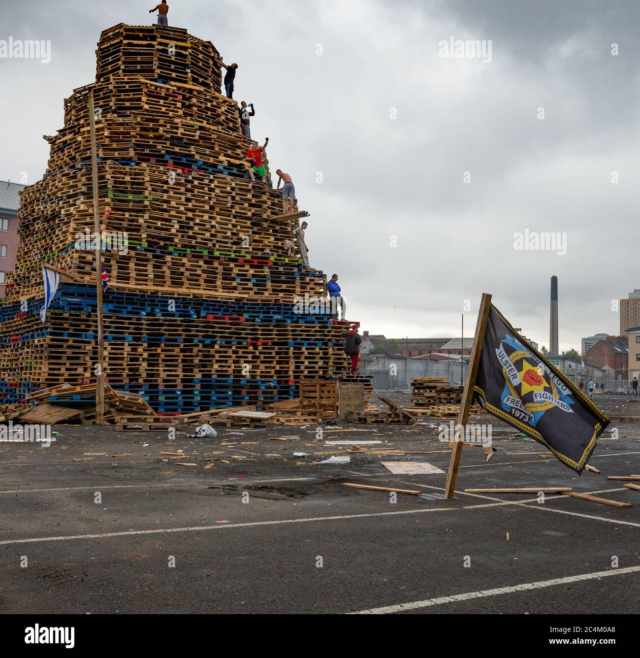 man standing at the top of a bonfire Sandy Row, Belfast Stock Photo - Alamy