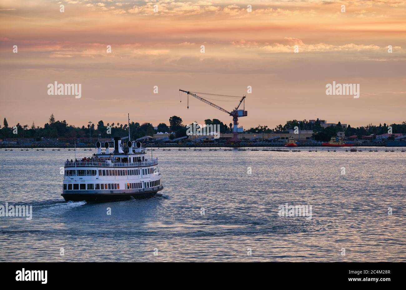 Ferry and Crane at Sunset Stock Photo - Alamy