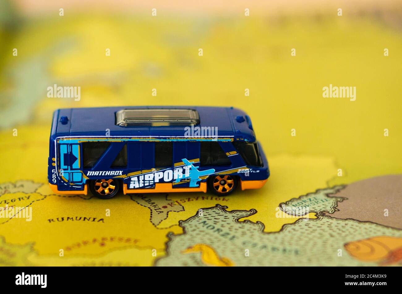 POZNAN, POLAND - Jun 10, 2019: Matchbox toy airport toy bus on world ...