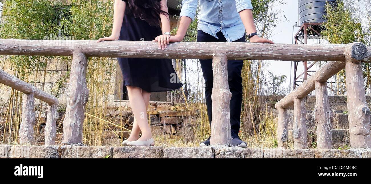 Couple behind wooden fence hi-res stock photography and images - Alamy