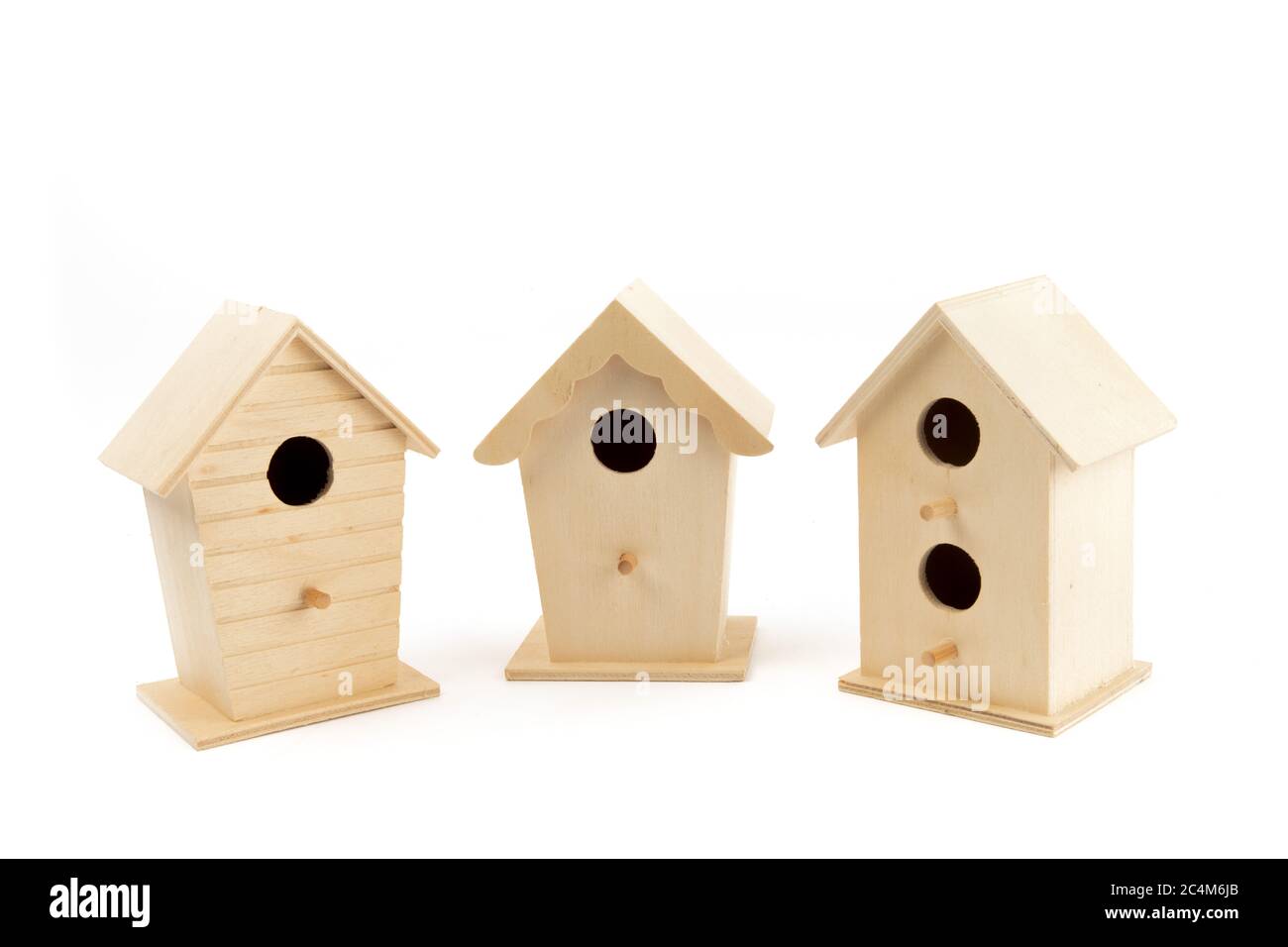a row of bird houses representing the real estate market isolated on ...