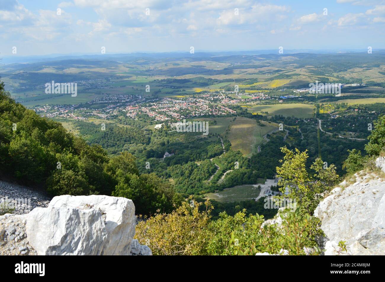 High angle shot of a beautiful village surrounded by grass-covered ...
