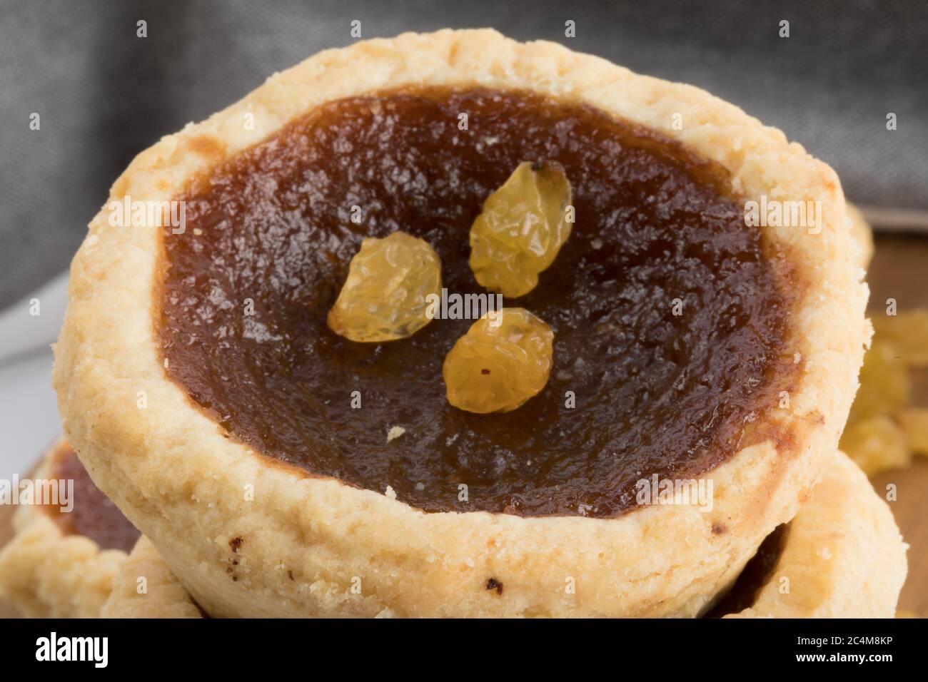 closeup of a batter tart showing the raisins on top Stock Photo - Alamy