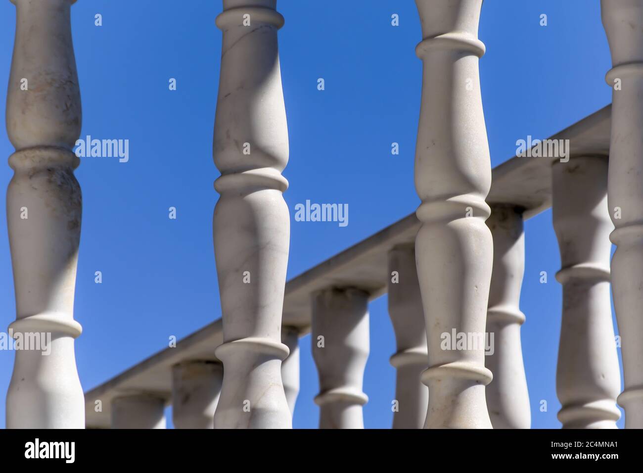 Low angle shot of the white balcony pillars made from marble Stock ...