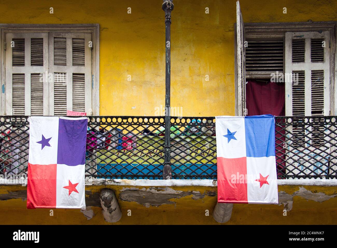 Flags of Panama hanging from the balconies of the houses under the ...
