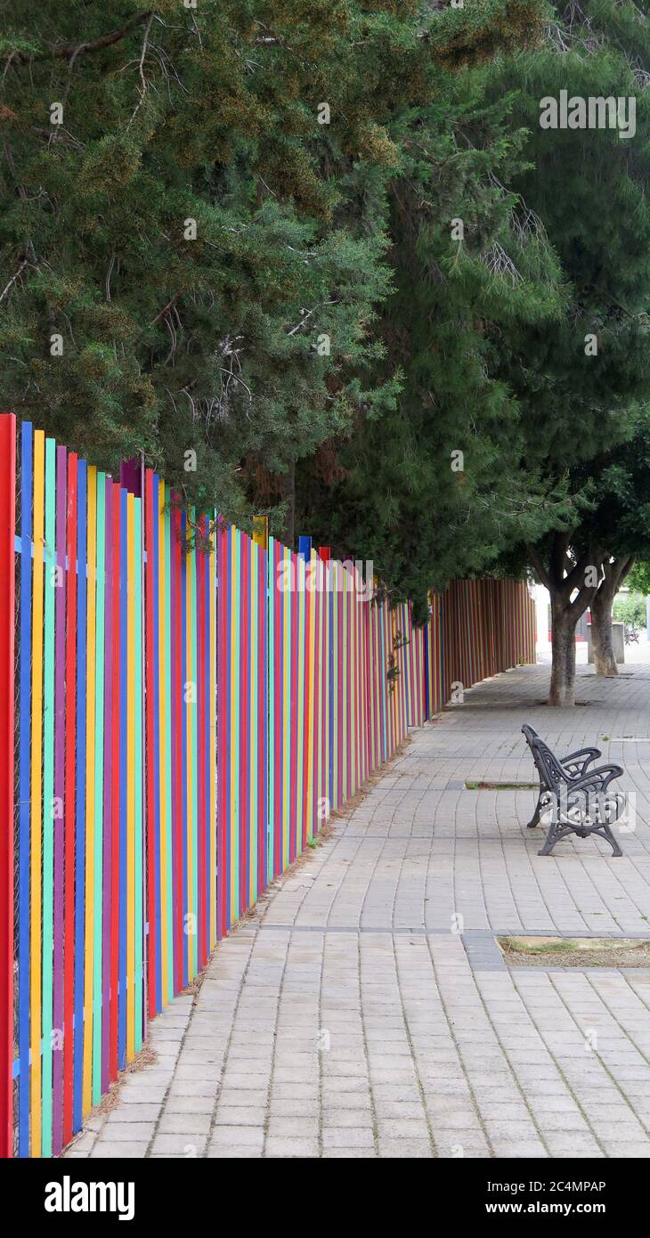 Multi colored fence outside Alora primary School, Andalusia Stock Photo ...