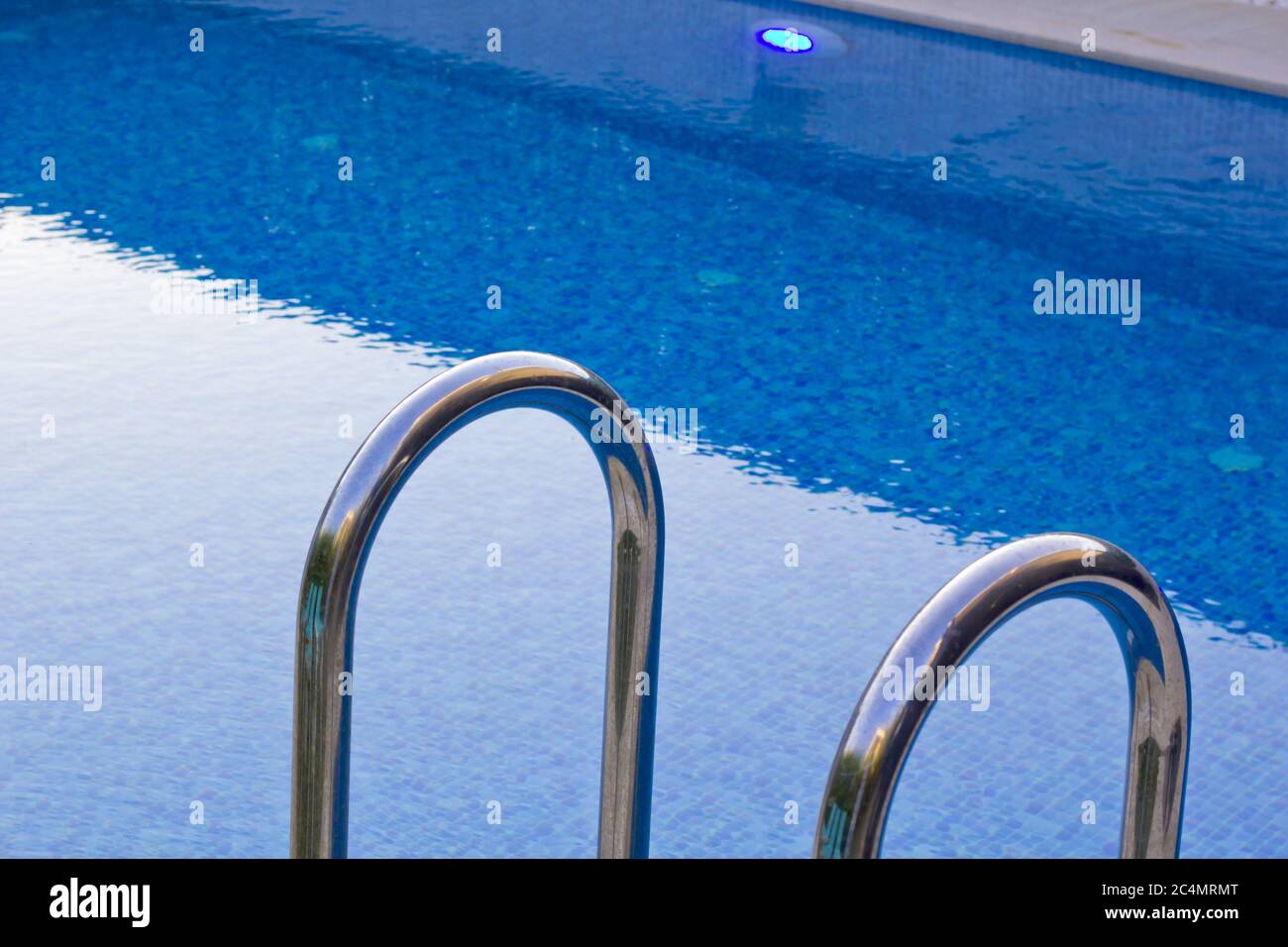 Blue swimming pool in a resort Stock Photo - Alamy