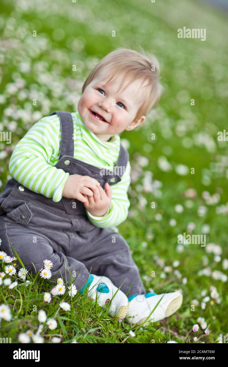Little baby in nature. Toddler on the green grass Stock Photo - Alamy